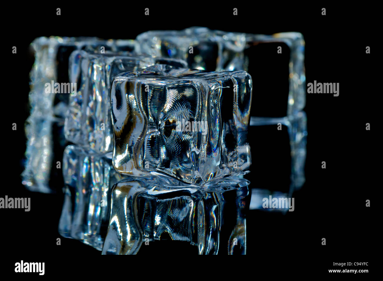 5 ice cube on the black background with reflection Stock Photo - Alamy