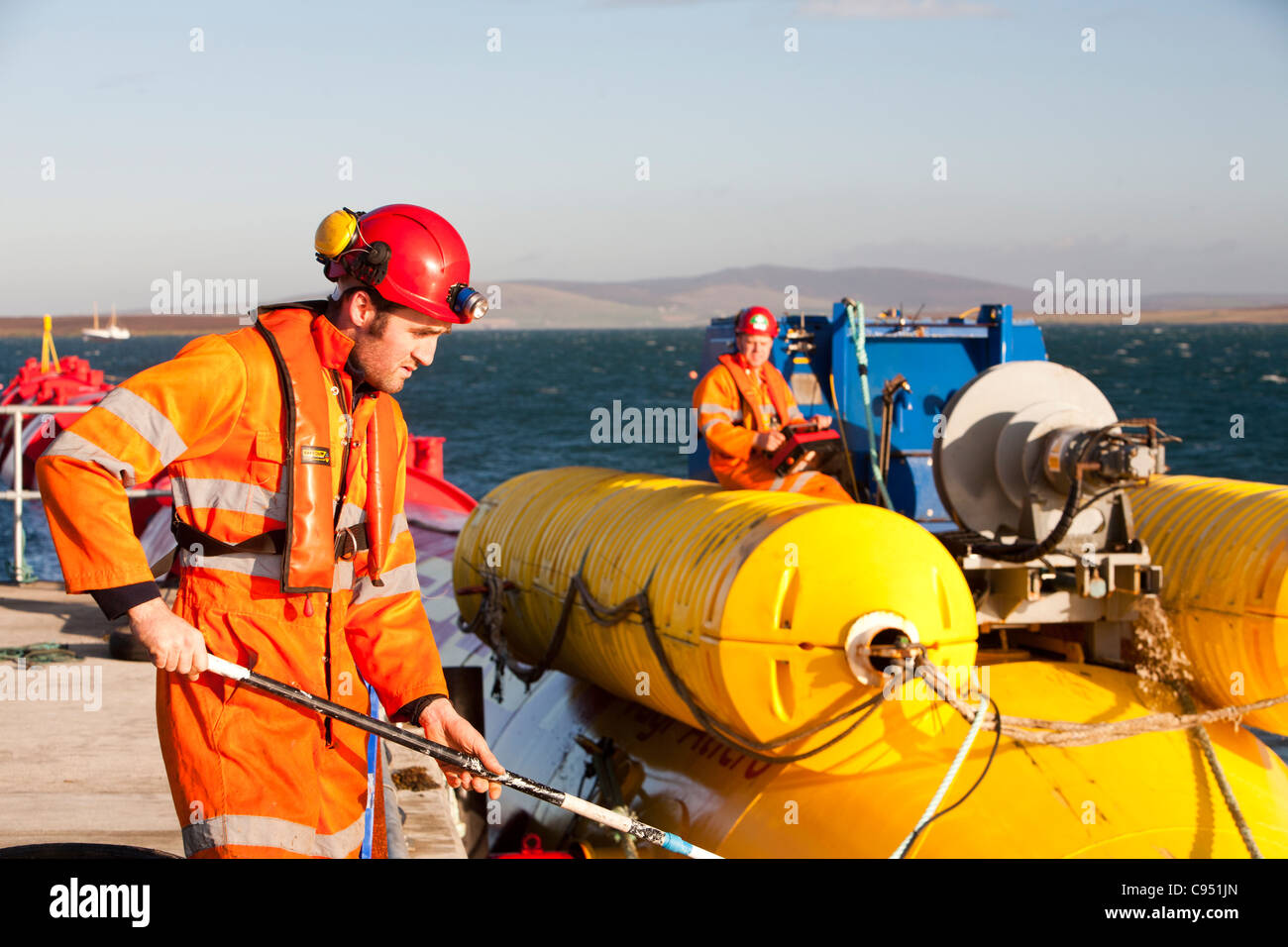 A Pelamis P2 wave energy generator on the dockside at Lyness on Hoy ...