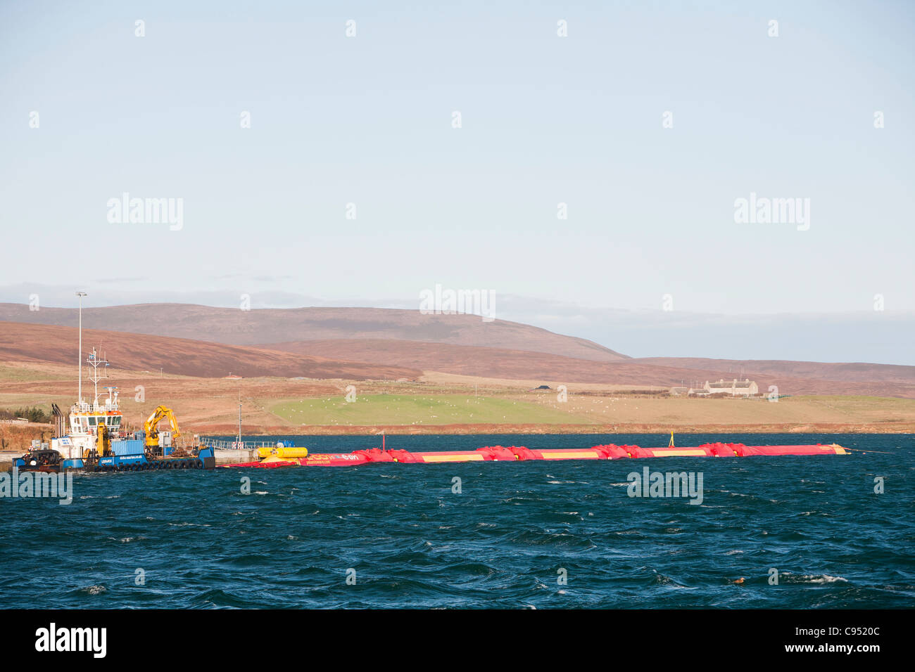A Pelamis P2 wave energy generator on the dockside at Lyness on Hoy ...
