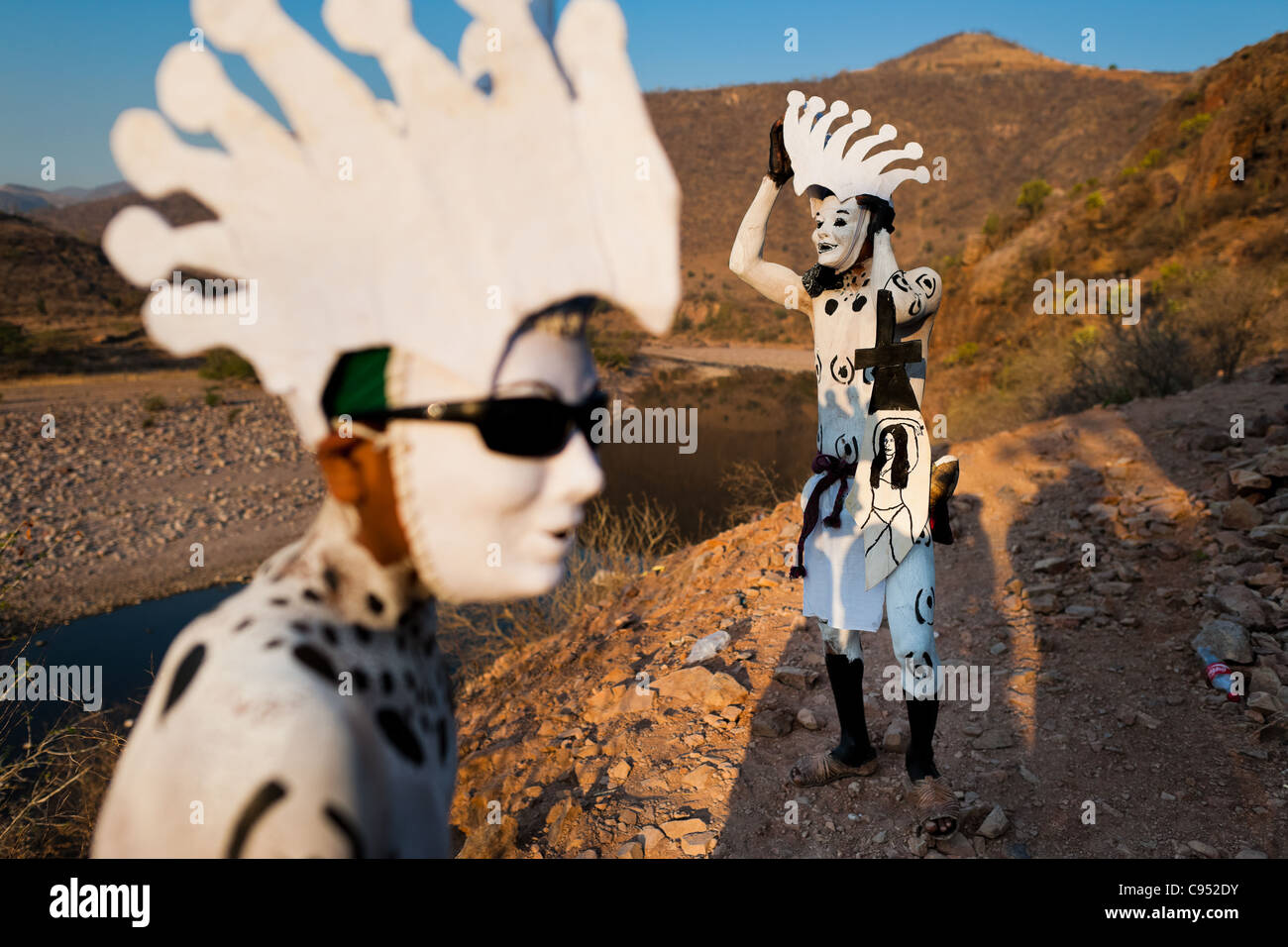 Cora Indians, wearing masks, prepare themselves for the religious ...