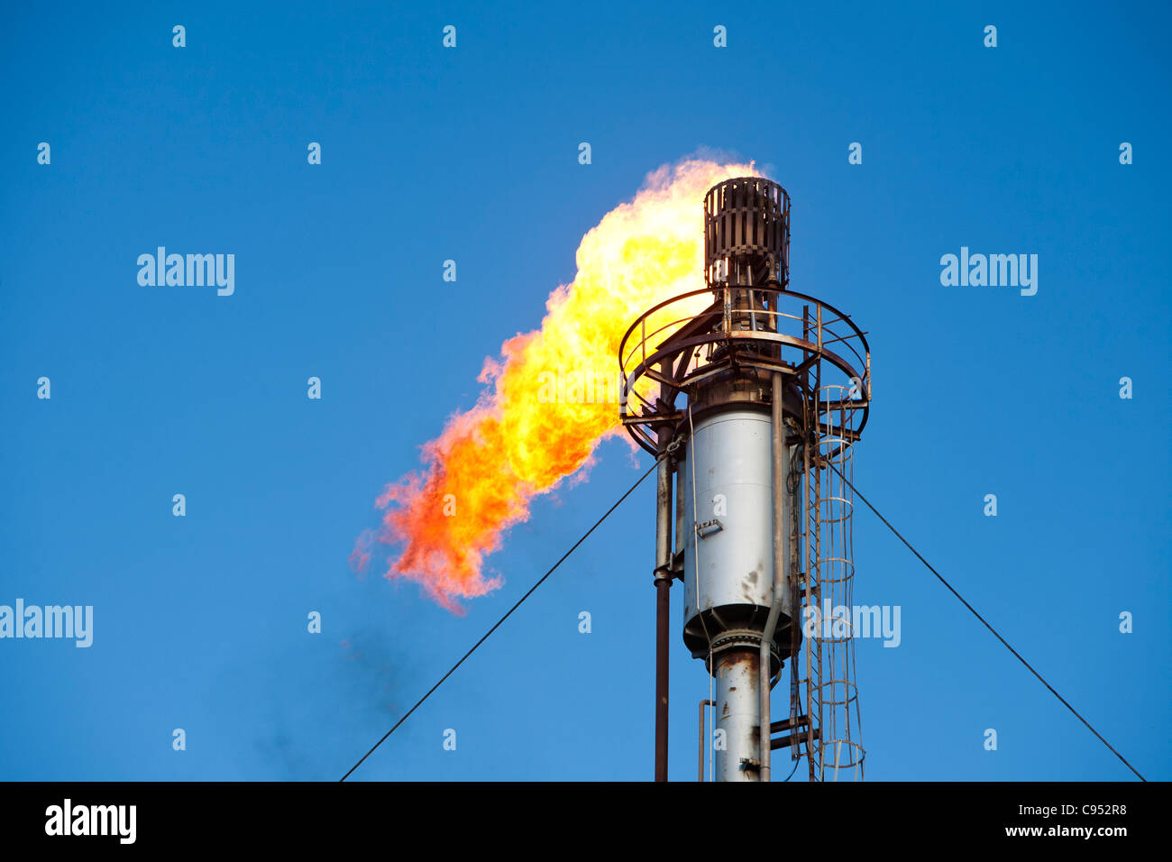 Flaring of waste gas at Flotta oil terminal in the Orkney's Scotland ...