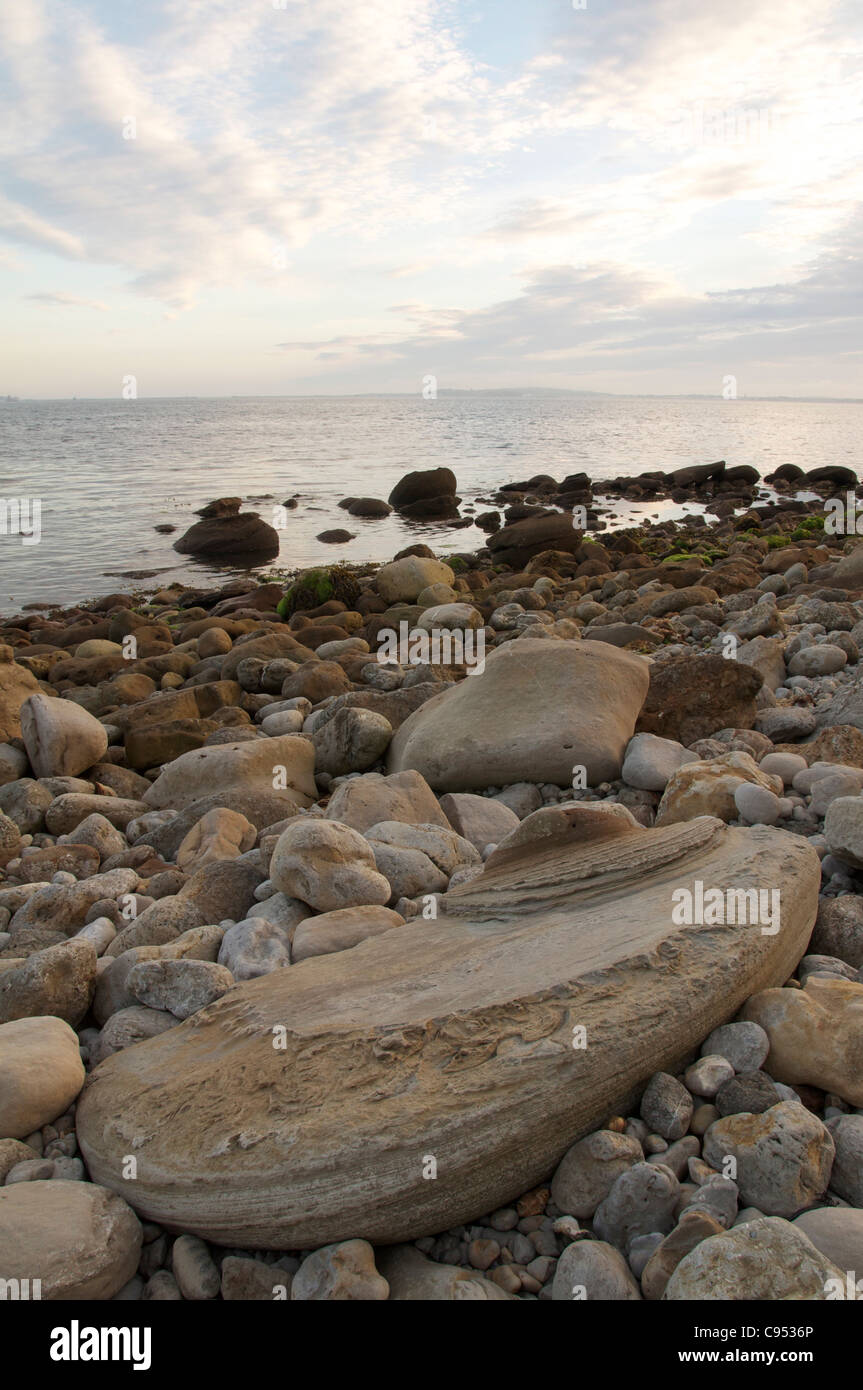 This rugged, rocky, boulder strewn beach, east of Osmington Mills in ...