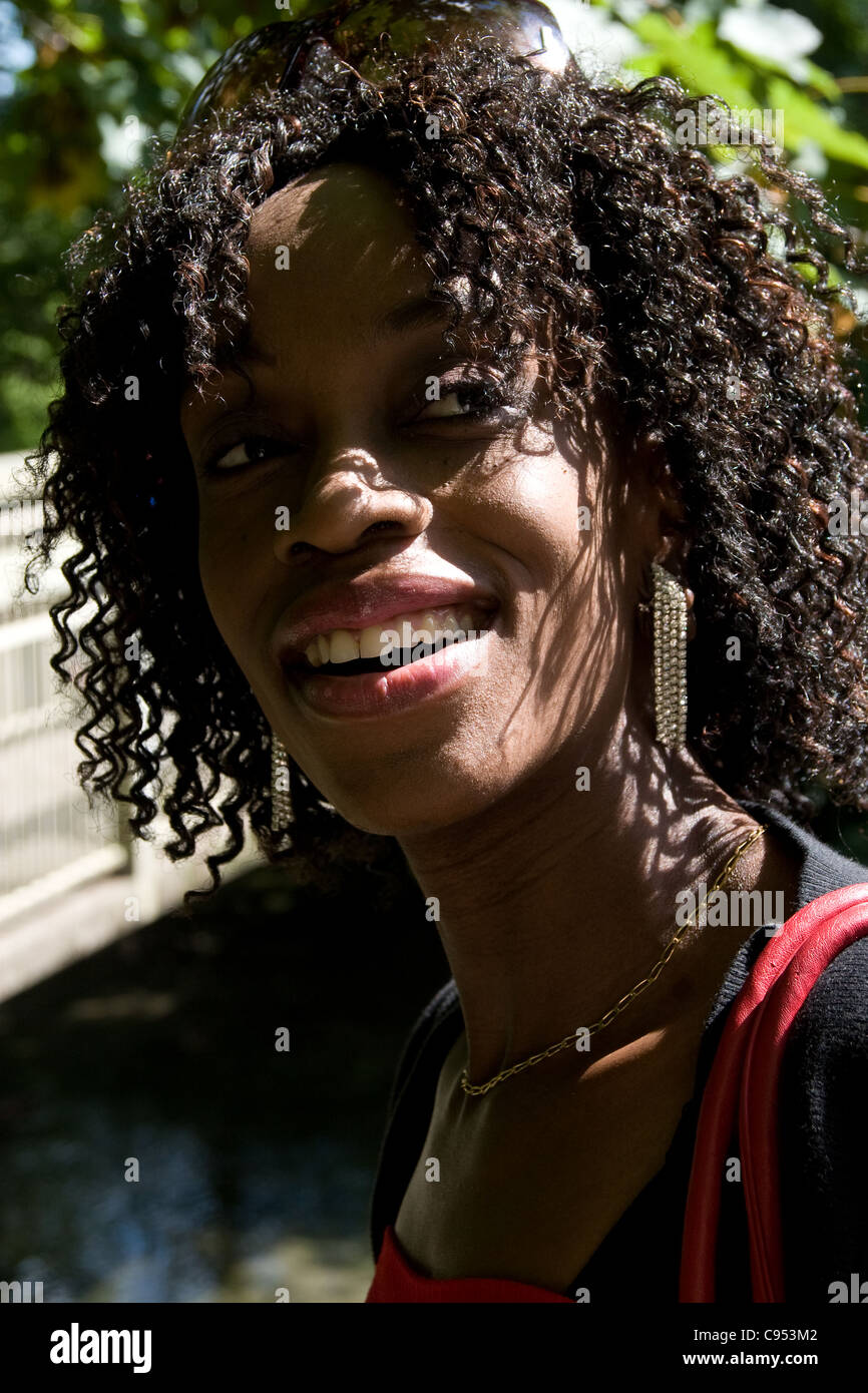 Black slim Zambian women smiling castle grounds Stock Photo - Alamy