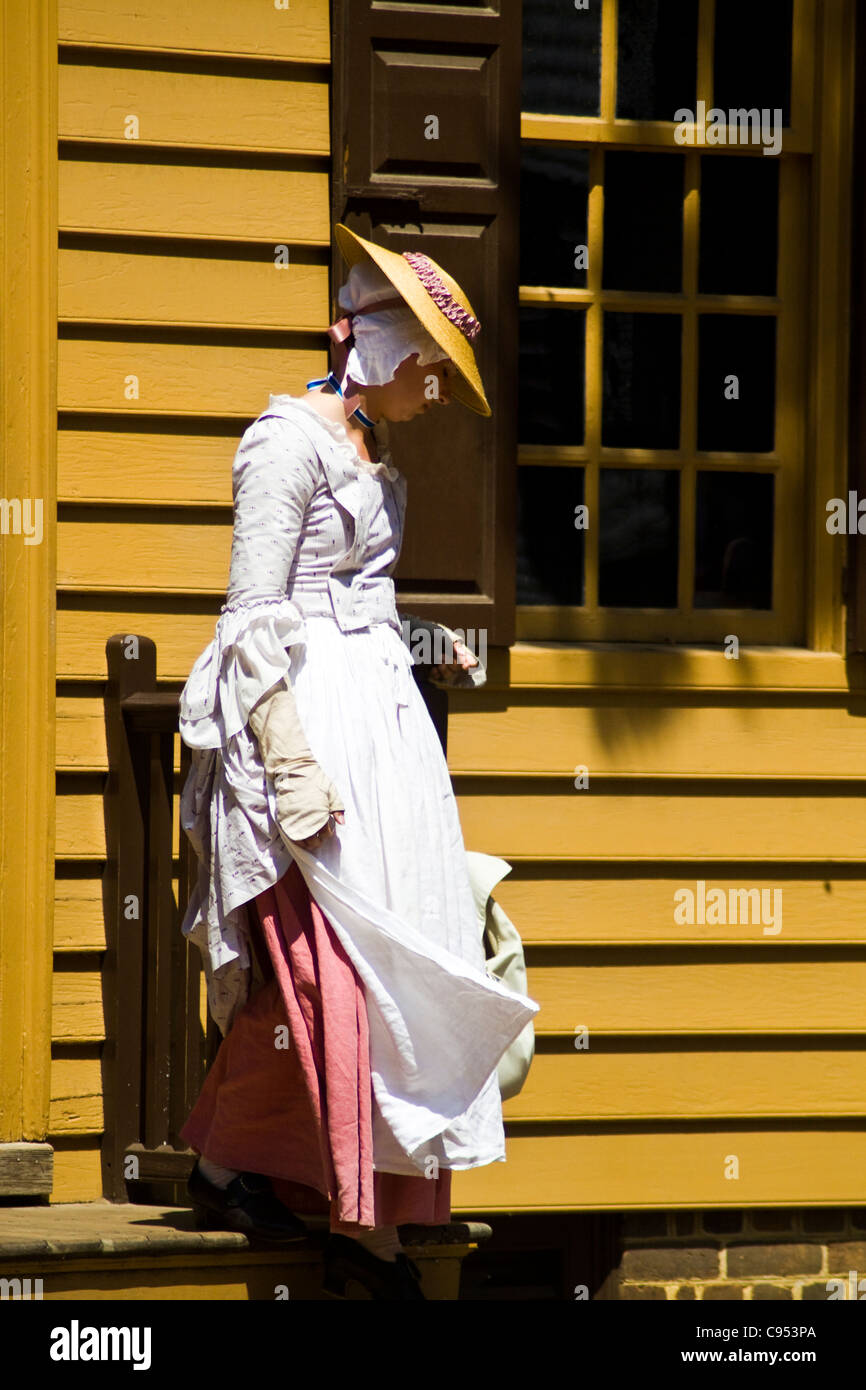 A female interpreter walking down flight steps at a shop in Virginia's ...