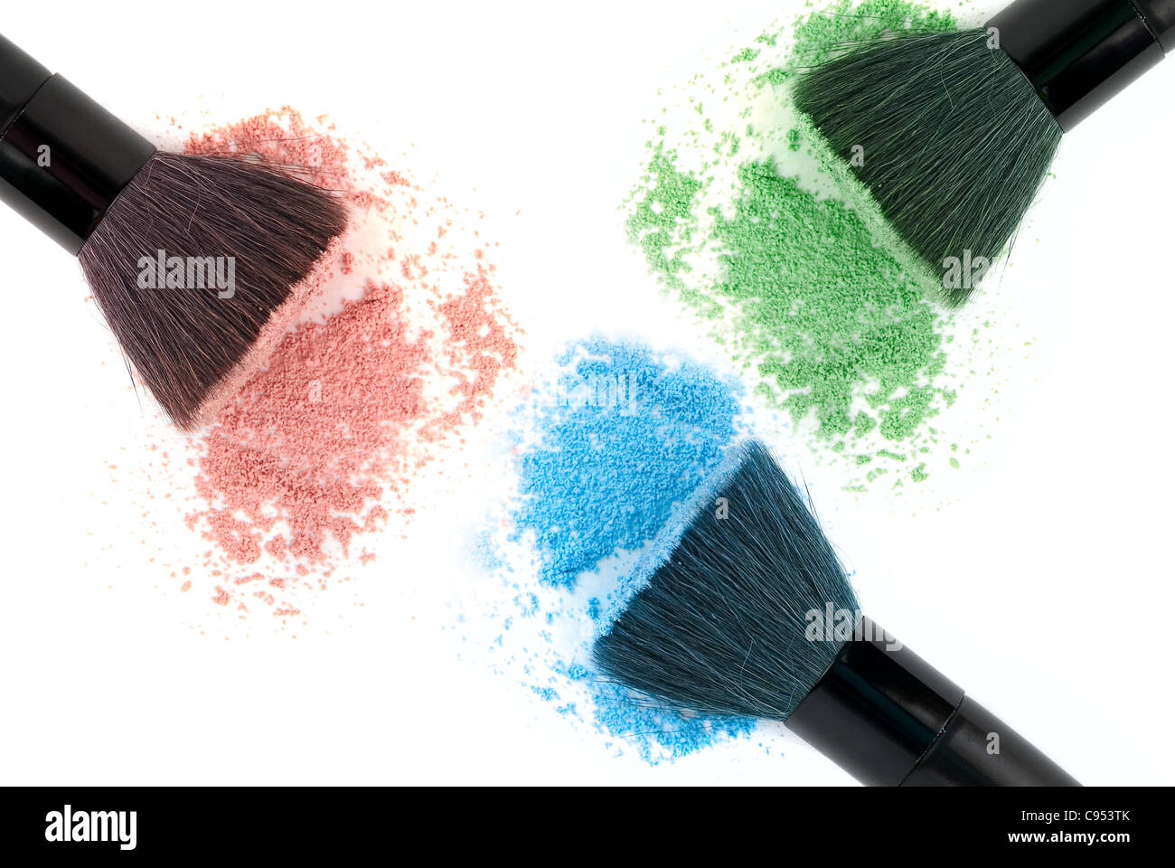 Three color powders set and black brush isolated Stock Photo - Alamy
