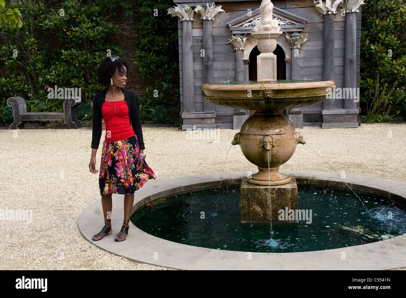 Black slim Zambian women smiling castle grounds Stock Photo - Alamy