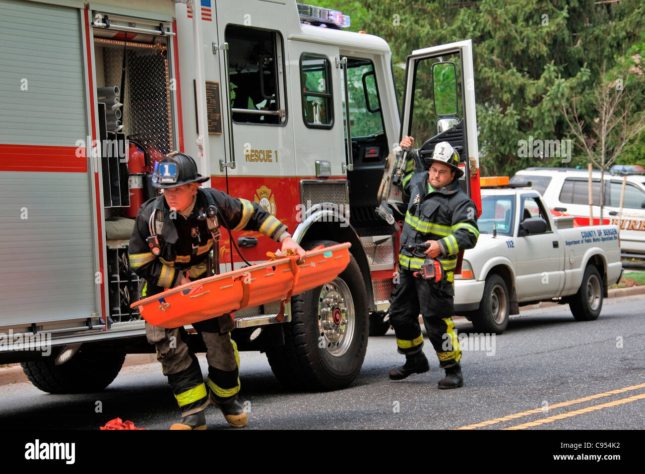 Firefighters arrive at the scene of a fire Stock Photo - Alamy