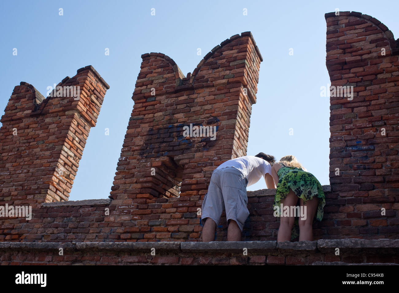 Couple looking over a bridge hi-res stock photography and images - Alamy