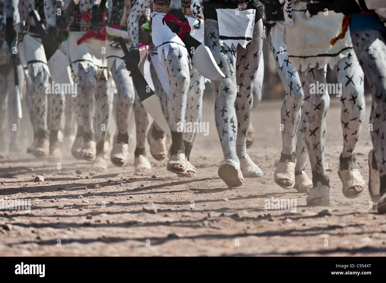 Cora Indians, with bodies painted all over, run during the religious ...
