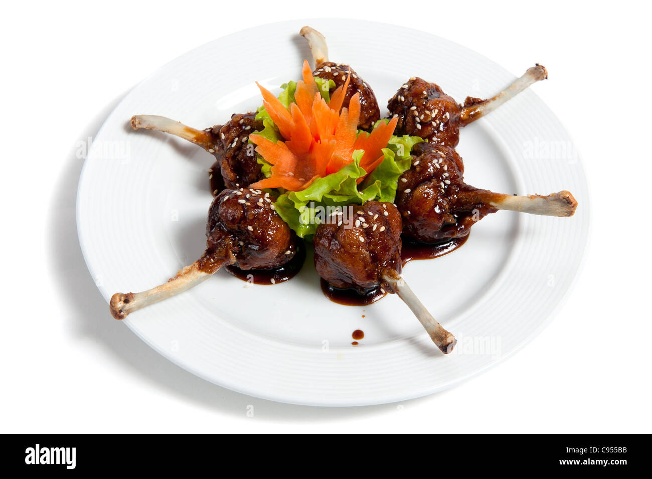 Roast chicken wings on a plate isolated on white background Stock Photo ...