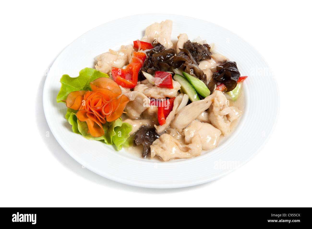 Stewed hen with vegetables on a plate isolated on white background ...