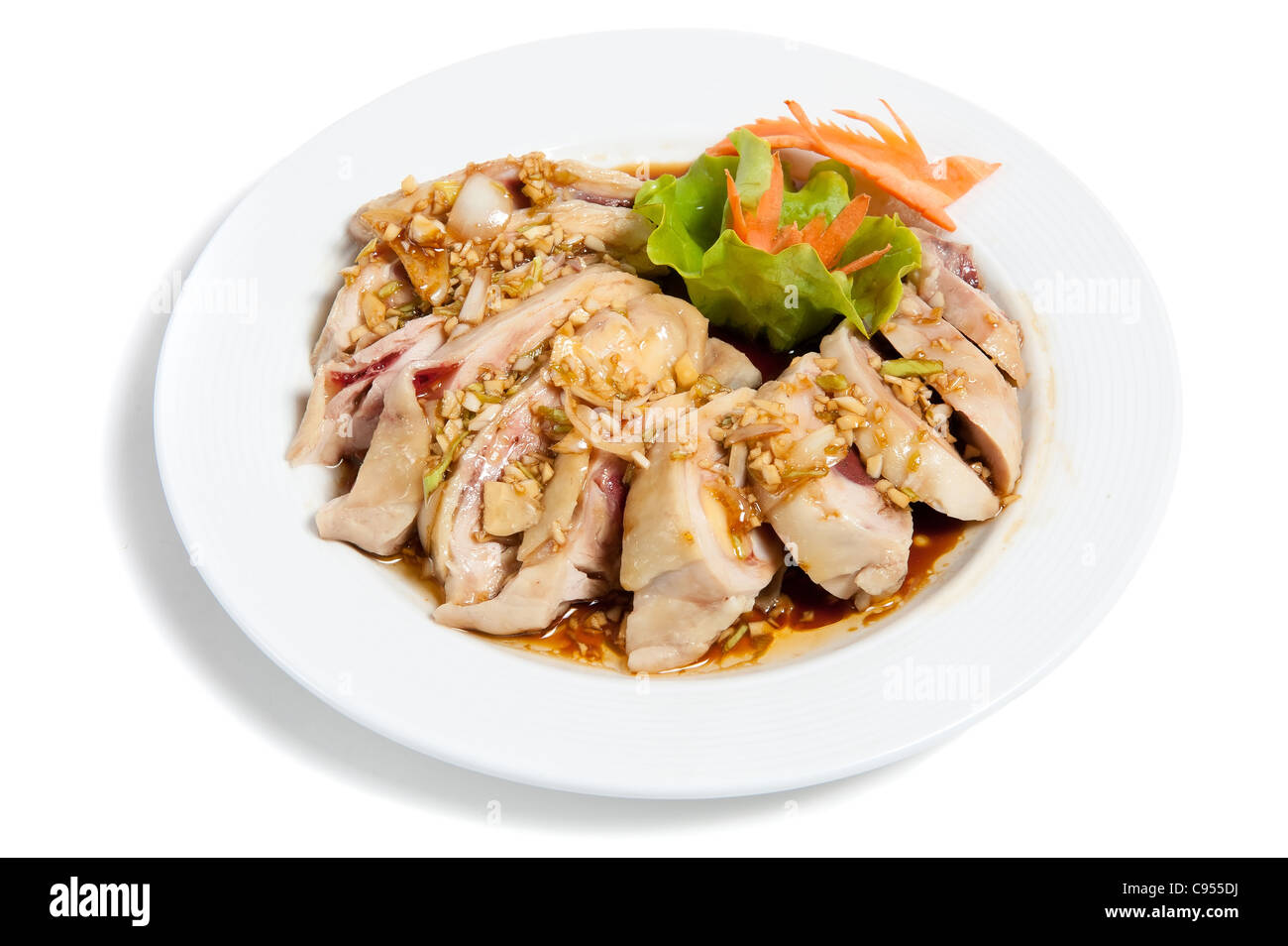Roasted hen in sauce on a plate isolated on white background Stock ...