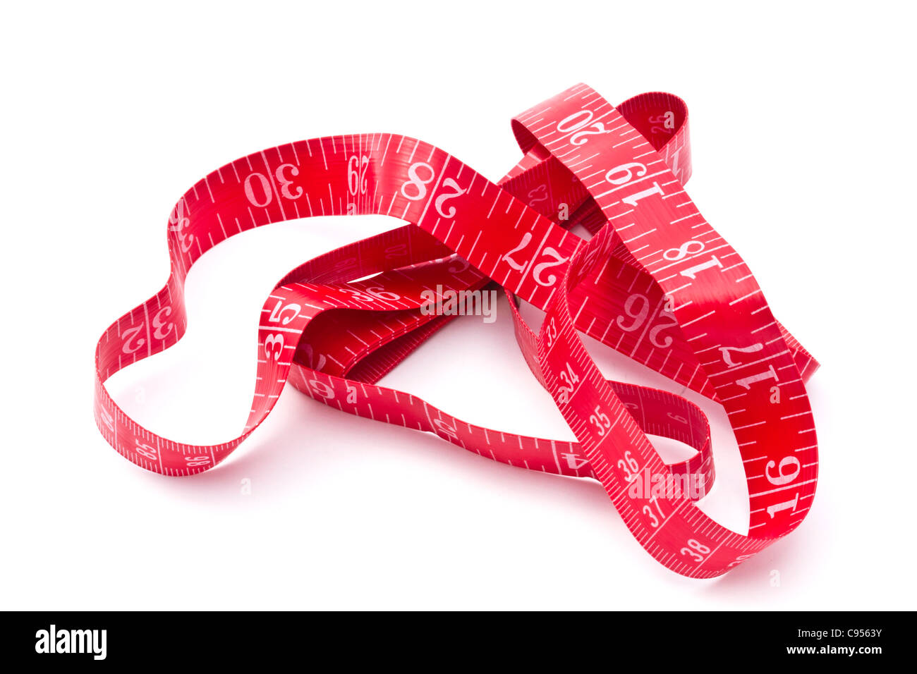 Red tape measure closeup on white background Stock Photo - Alamy