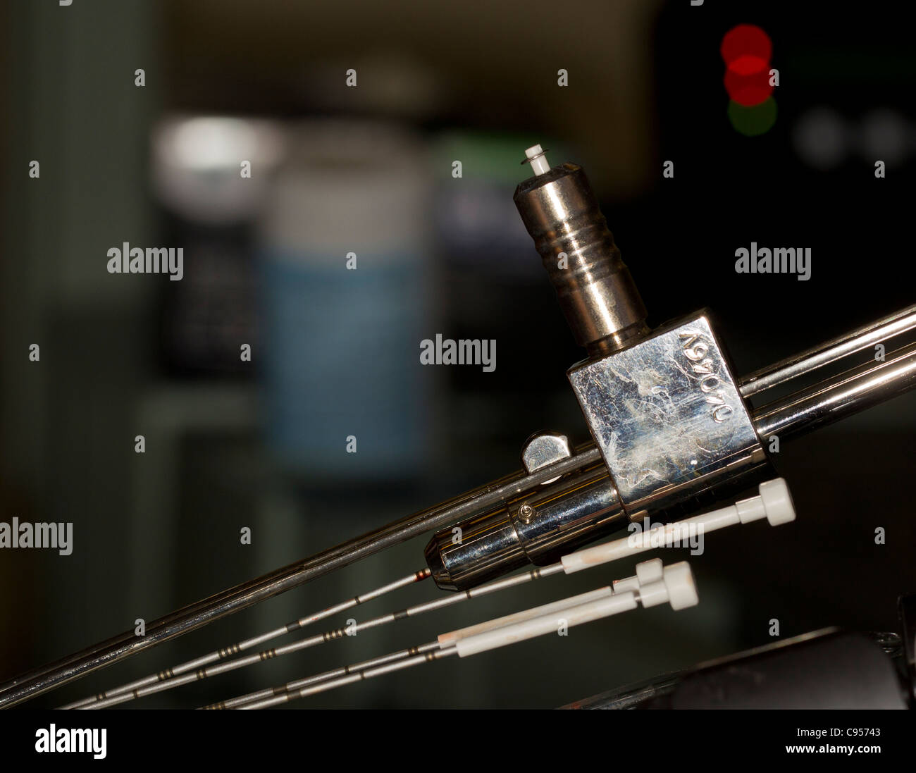 A Mick applicator being used to implant radioiodine seeds into a ...