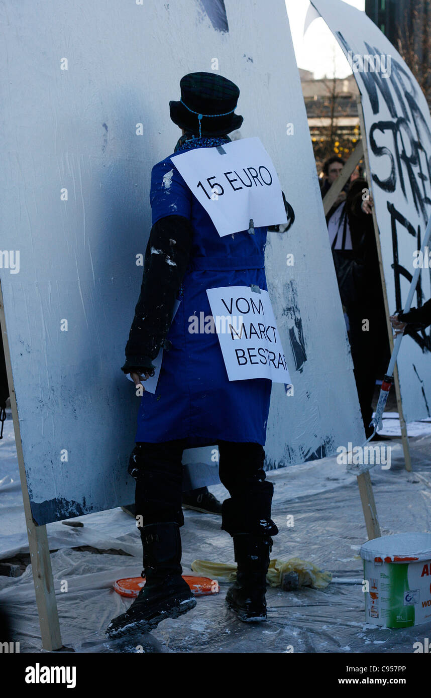 A student of the Academy of visual arts Leipzig is protesting with ...