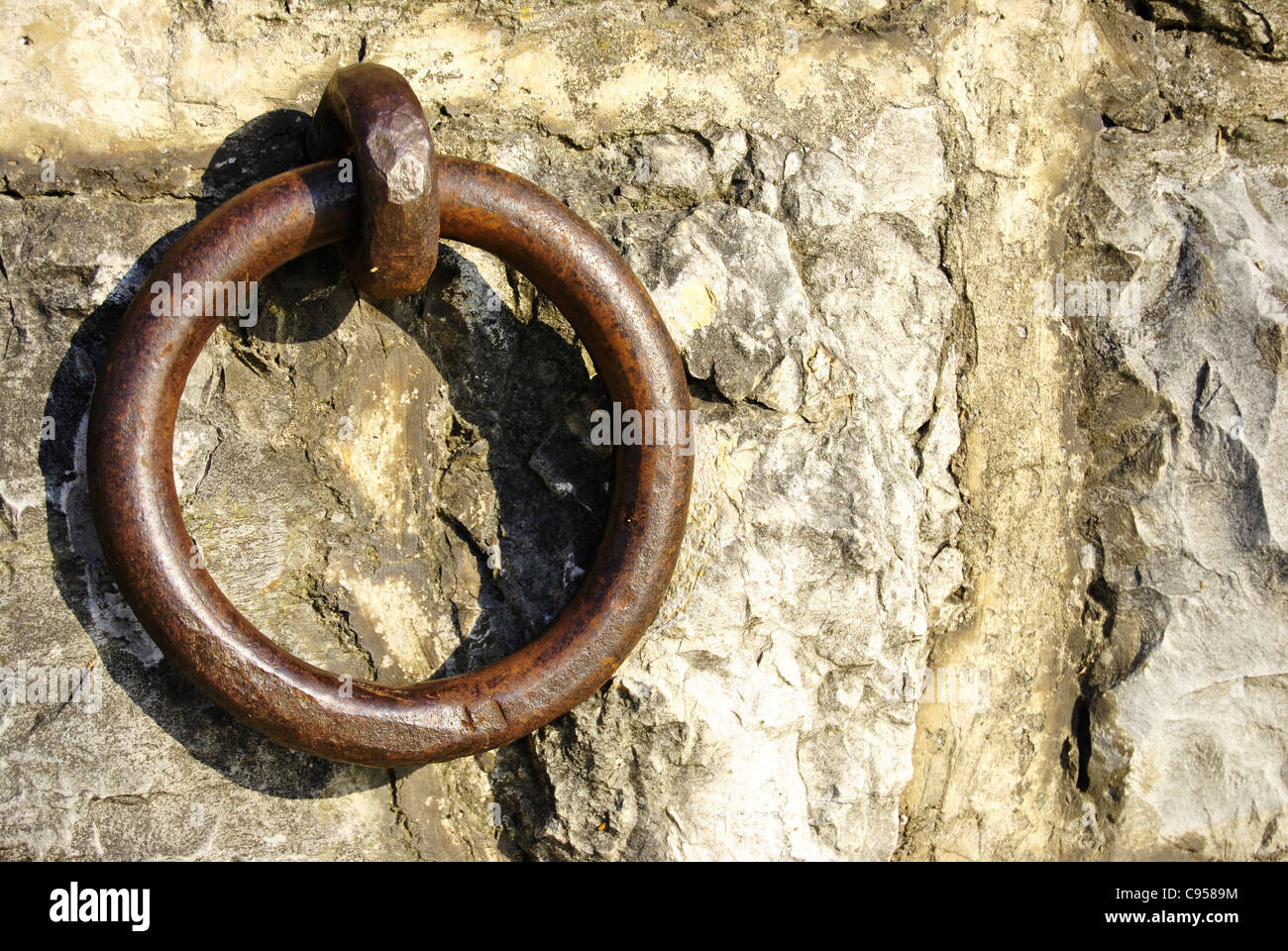 Rusty old ring at a brickwork wall in the Dutch city of Rovereto in ...