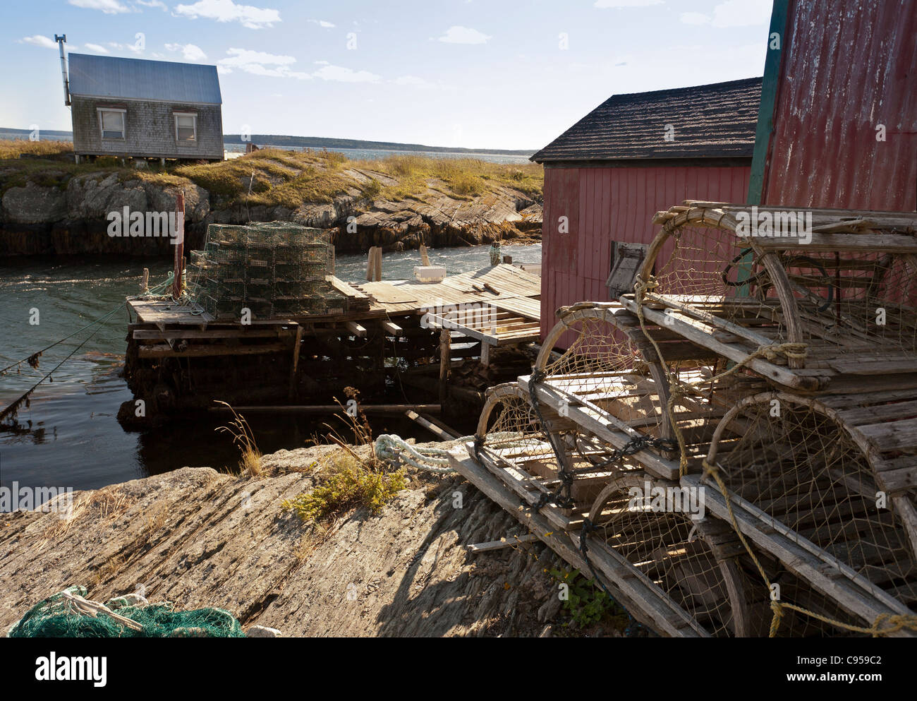 Fishing shack and Harbour at Blue Rocks. Two styles of lobster pots ...