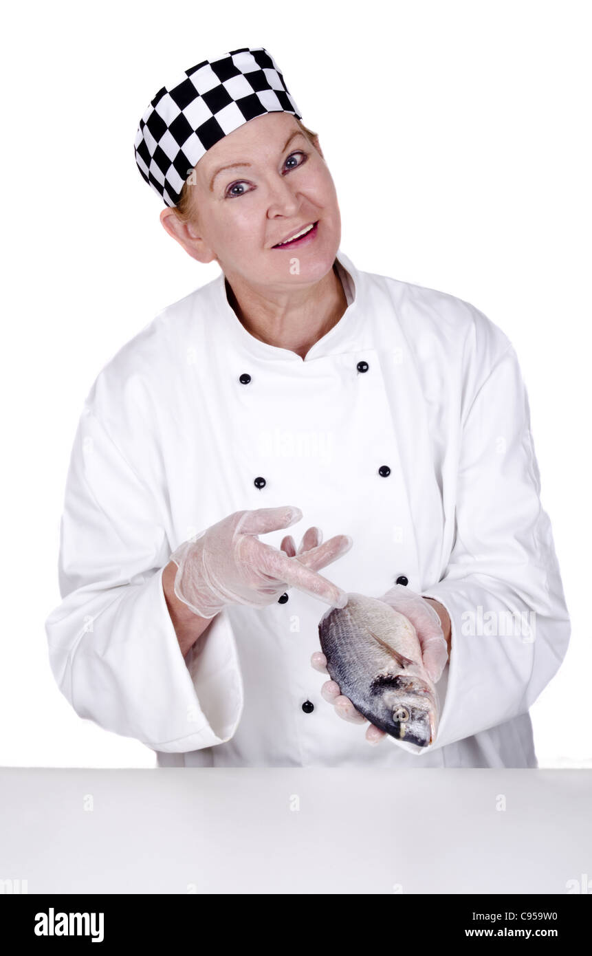 female chef shows with her index finger on a fresh sea bream Stock ...