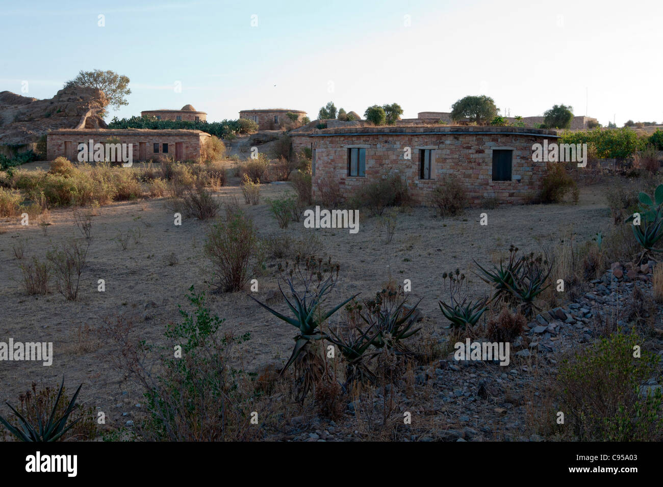 View of the stone-built bungalows at Gheralta Lodge near the village of ...
