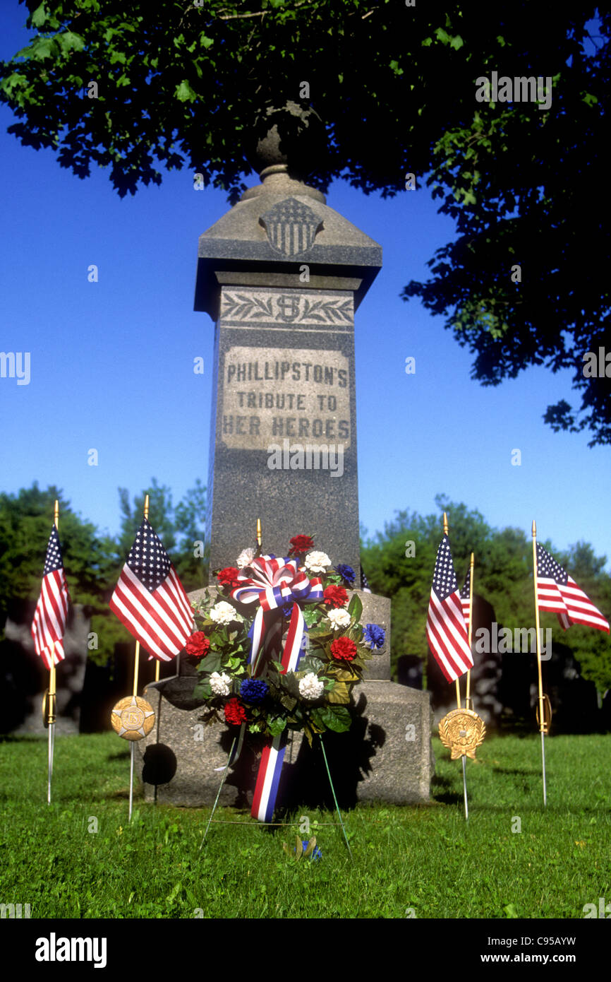 A flags and a wreath decorate a war monument Stock Photo - Alamy