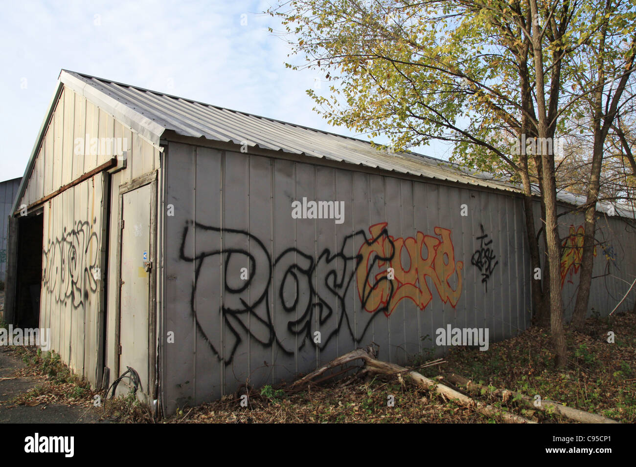 An abandoned storage building covered in graffiti Stock Photo - Alamy