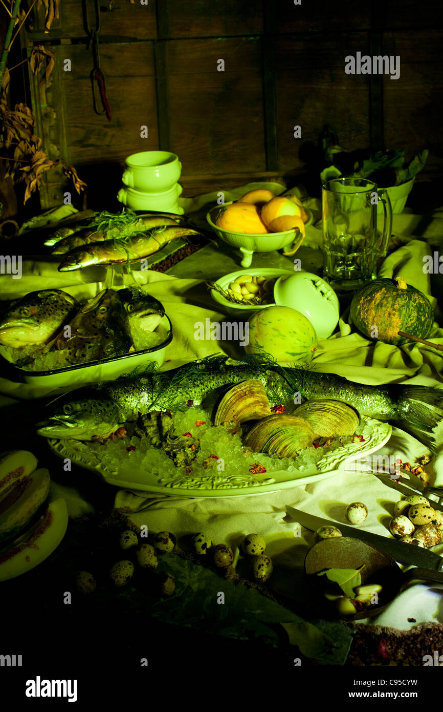 Feast with fish and fruit Stock Photo - Alamy