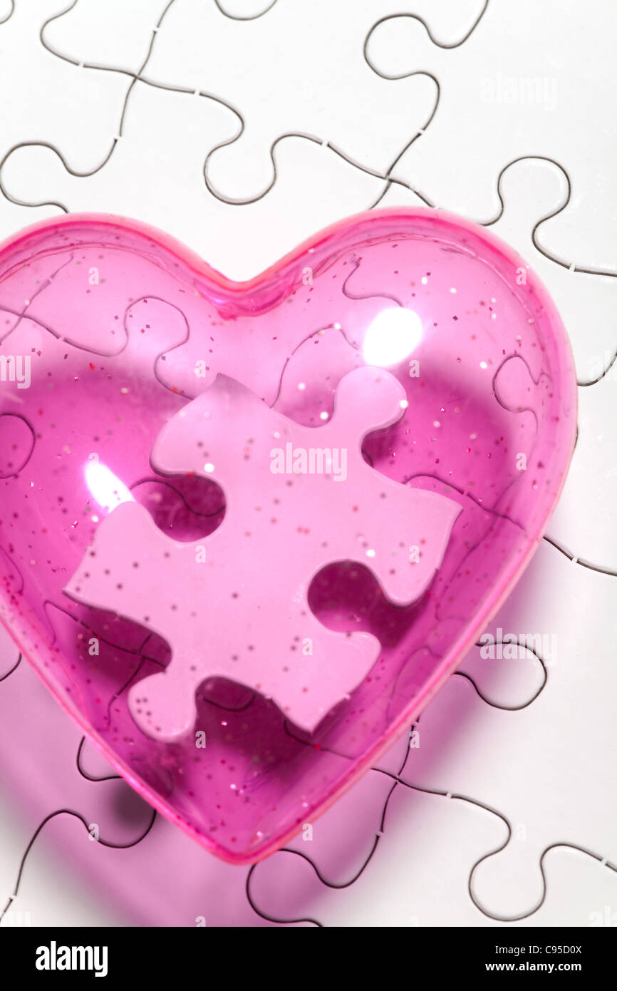 Red heart and Puzzle, love concept Stock Photo - Alamy