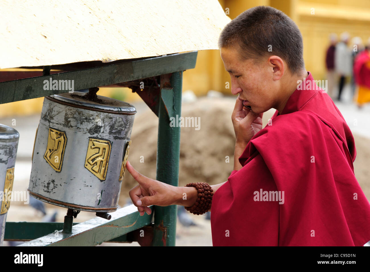 Monk using a mobile in the Gandantegchinlen (Gandan khiid) Monastery in ...