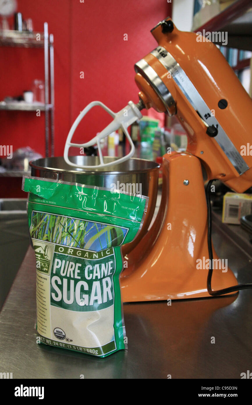 A bag of organic sugar next to a mixer Stock Photo - Alamy