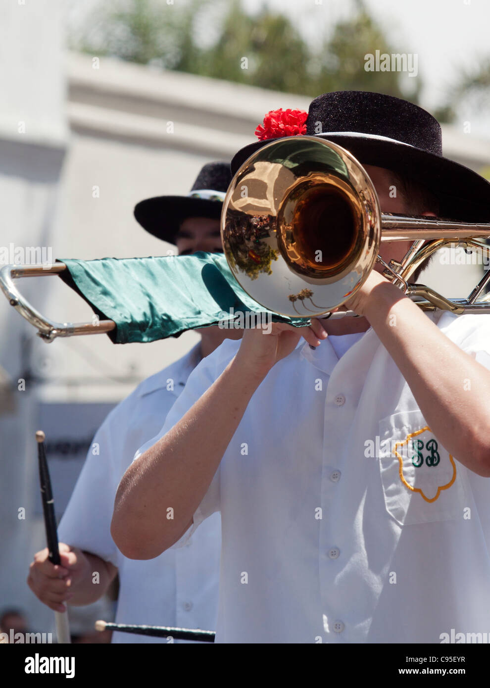 Musician playing trombone and marching in a parade Stock Photo - Alamy