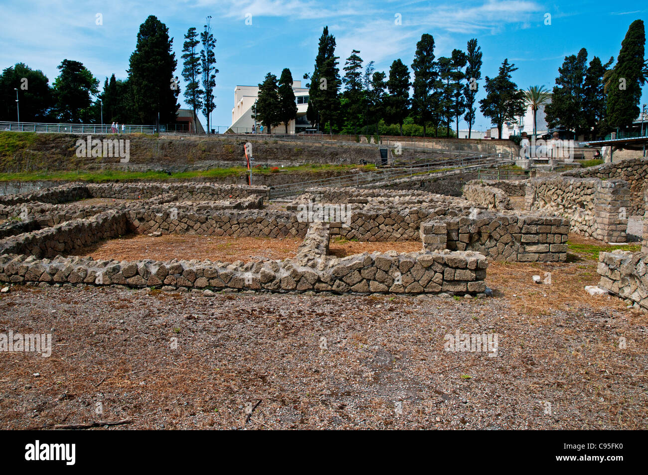 The administration building overlooks the excavated foundations of ...