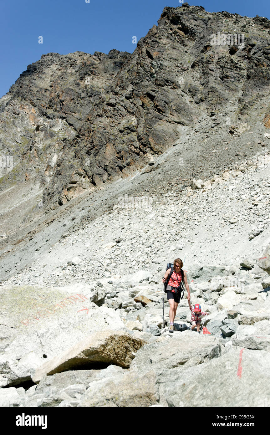 People walking to the Dix hut Switzerland Stock Photo - Alamy