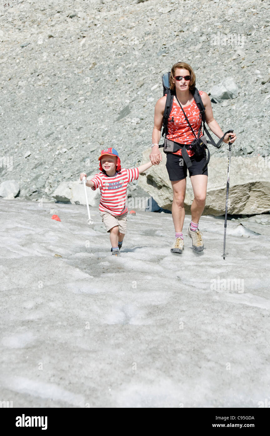 People walking to the Dix hut Switzerland Stock Photo - Alamy
