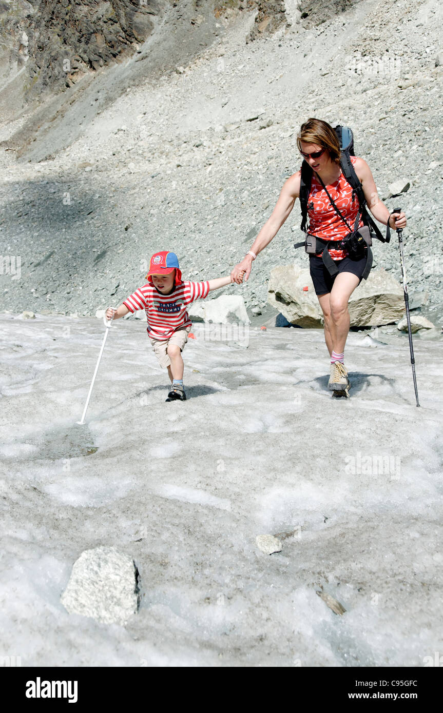 People walking to the Dix hut Switzerland Stock Photo - Alamy