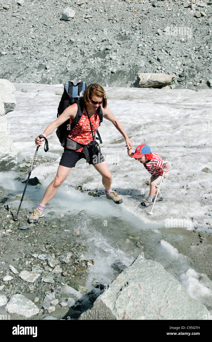 People walking to the Dix hut Switzerland Stock Photo - Alamy