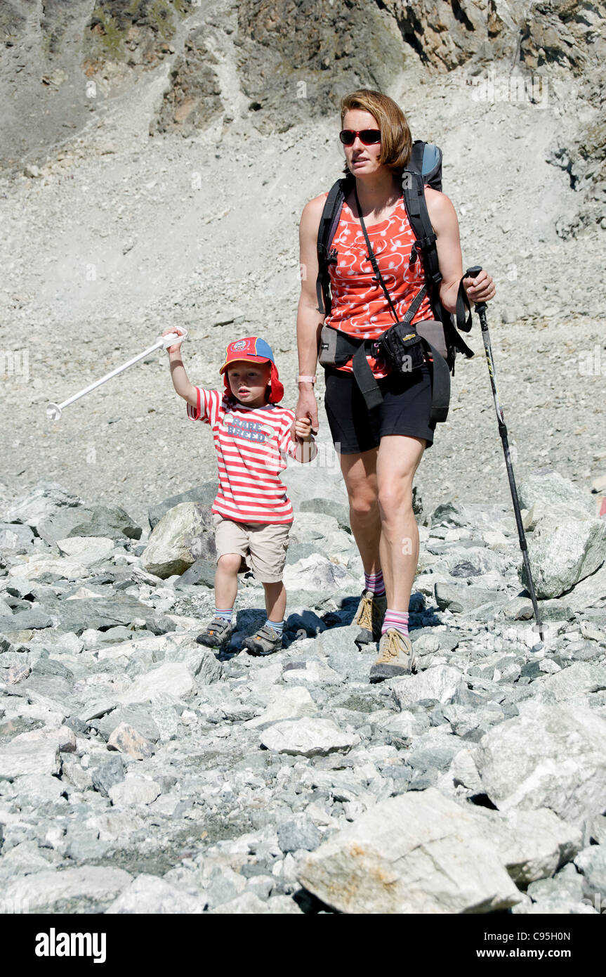 People walking to the Dix hut Switzerland Stock Photo - Alamy