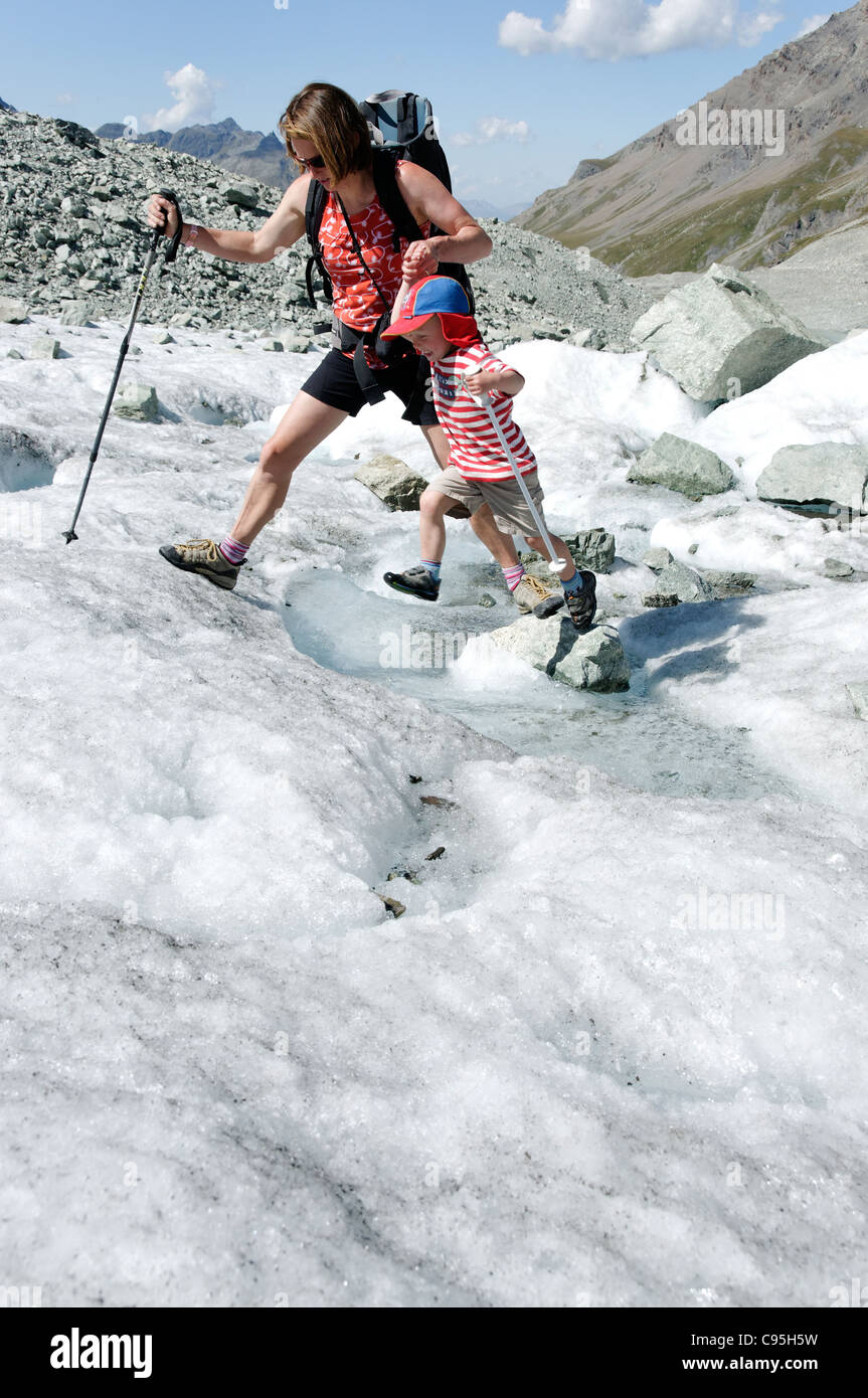 People walking to the Dix hut Switzerland Stock Photo - Alamy