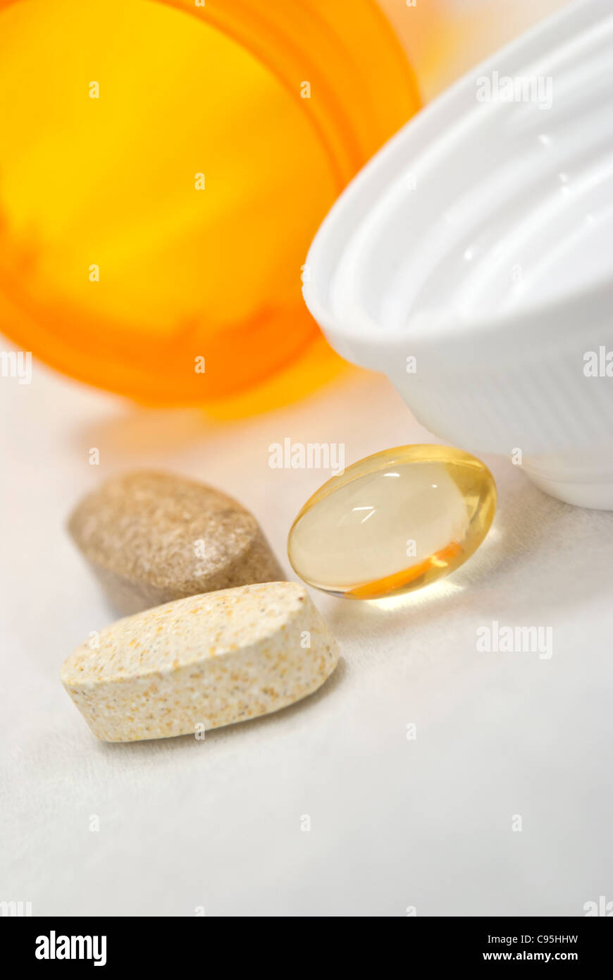 Child safe pill bottle open on a table with child safe lid nearby Stock ...