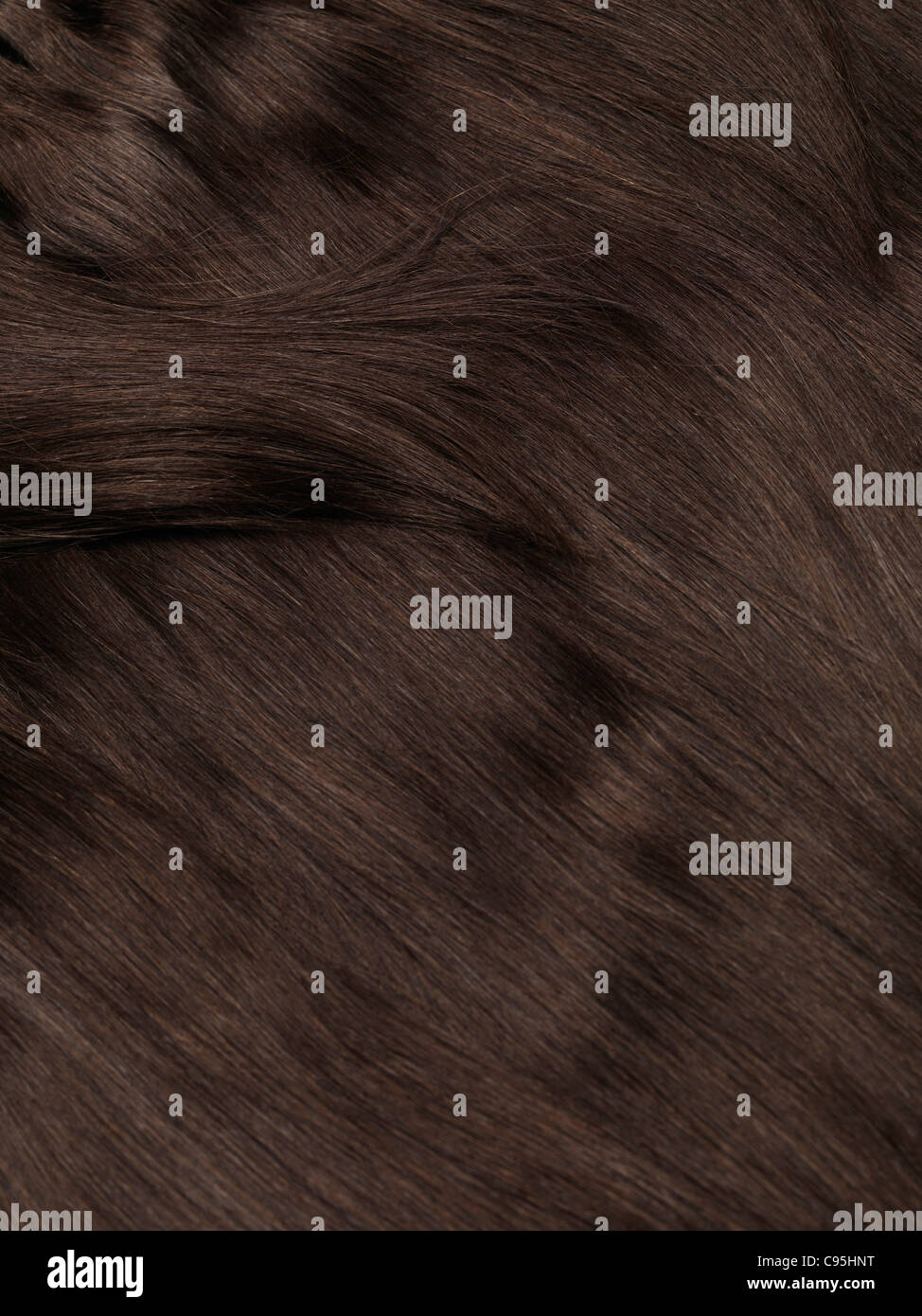 Brown natural human hair extensions background texture Stock Photo - Alamy