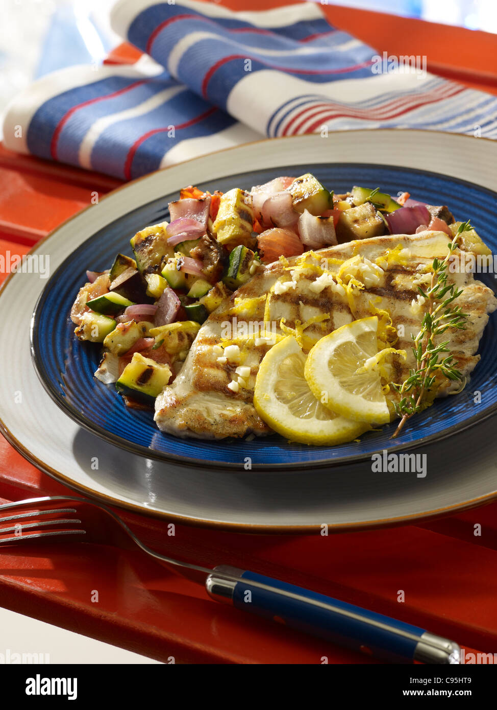 Chicken scallopini with grilled vegetables in a Fourth of July setting ...