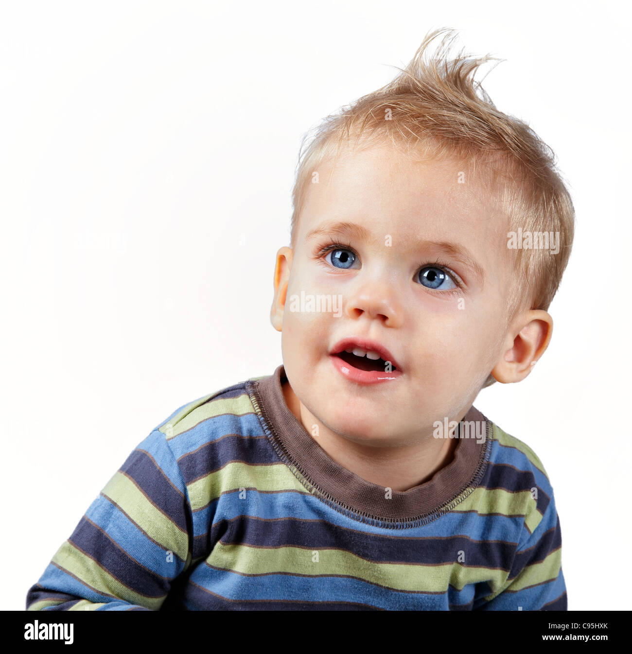 Studio portrait of a happy one year old baby boy on white Stock Photo ...