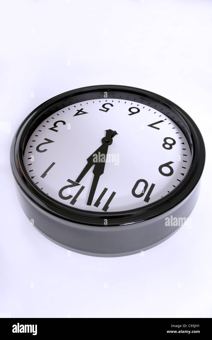 A clock at just before midnight Stock Photo - Alamy