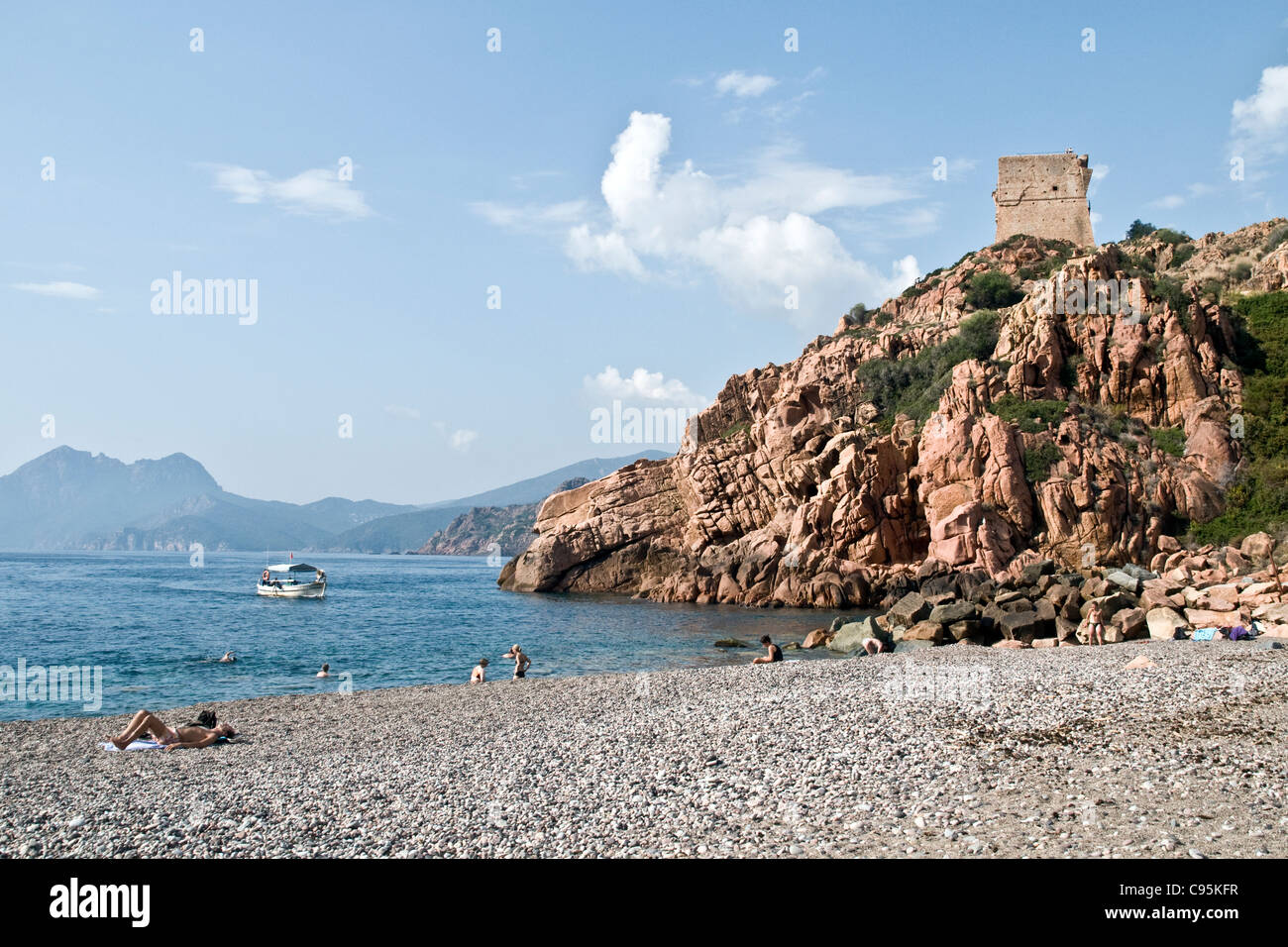 A rocky beach below a Genoan fort in the town of Porto, on the Gulf of ...