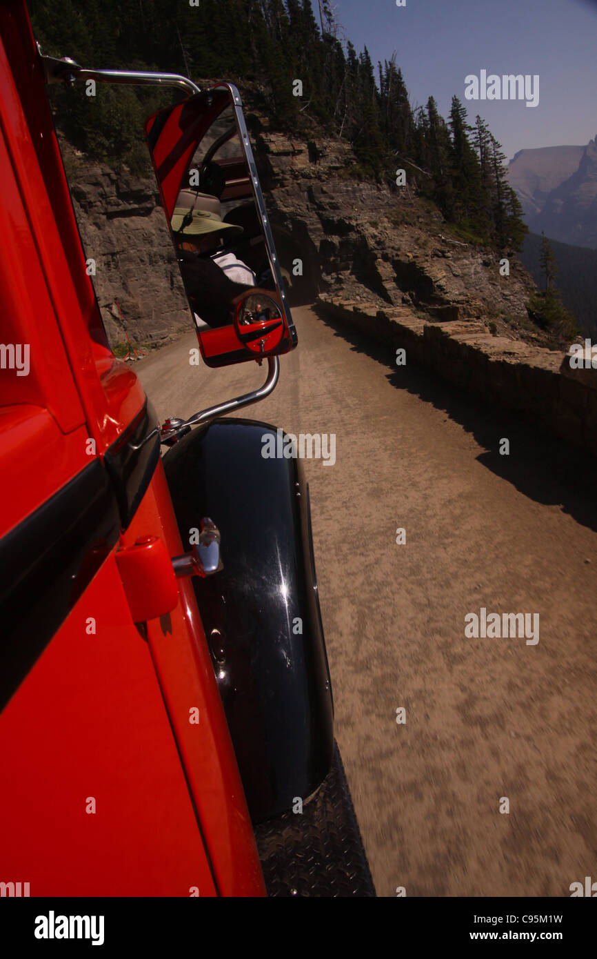 Red bus of glacier national park Stock Photo - Alamy