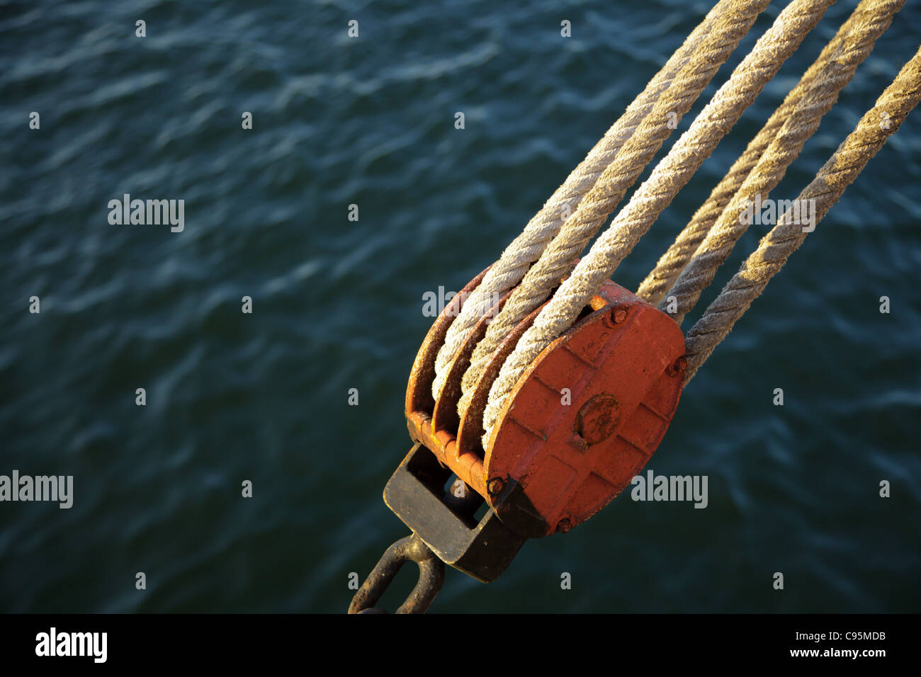 view of a blue sea through the wires, rope Detail, rigging of boat ...