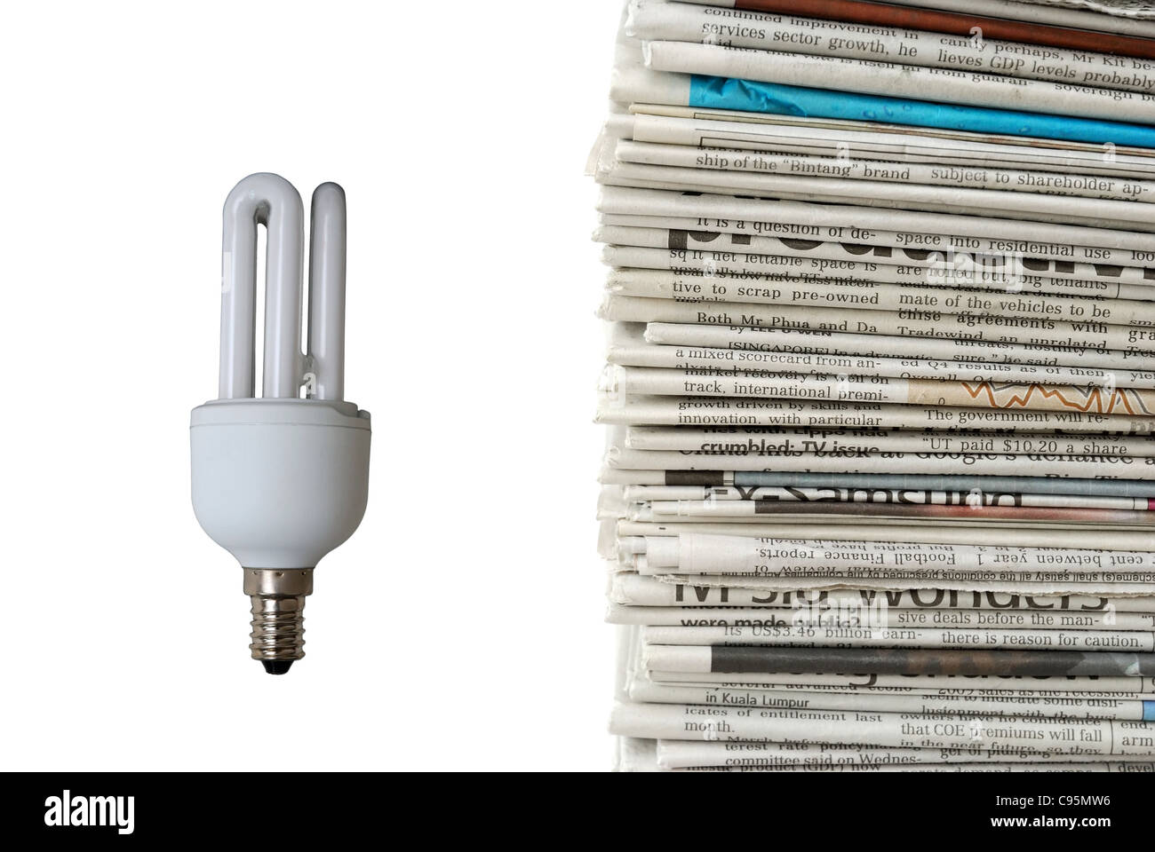 Light bulb and newspapers isolated on white background Stock Photo - Alamy