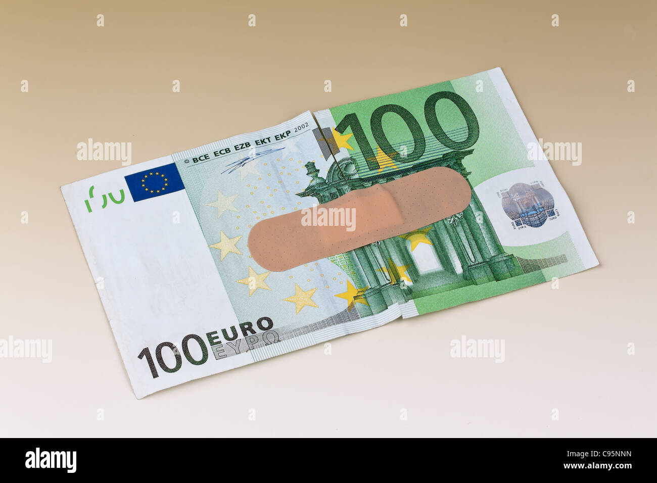 Euro banknotes with a band-aid Stock Photo - Alamy