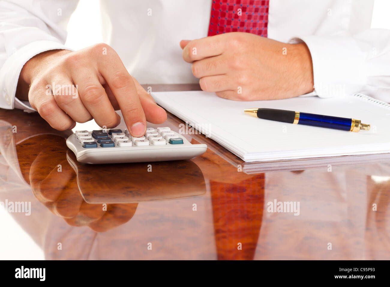 Businessman with a calculator. Calculation of costs, revenues, balance ...
