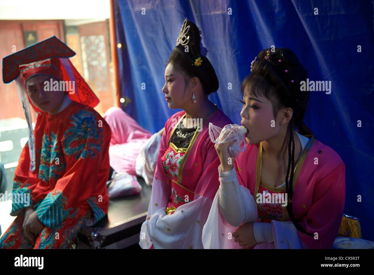 Chinese Huangmei opera artists from Anhei province rest backstage ...