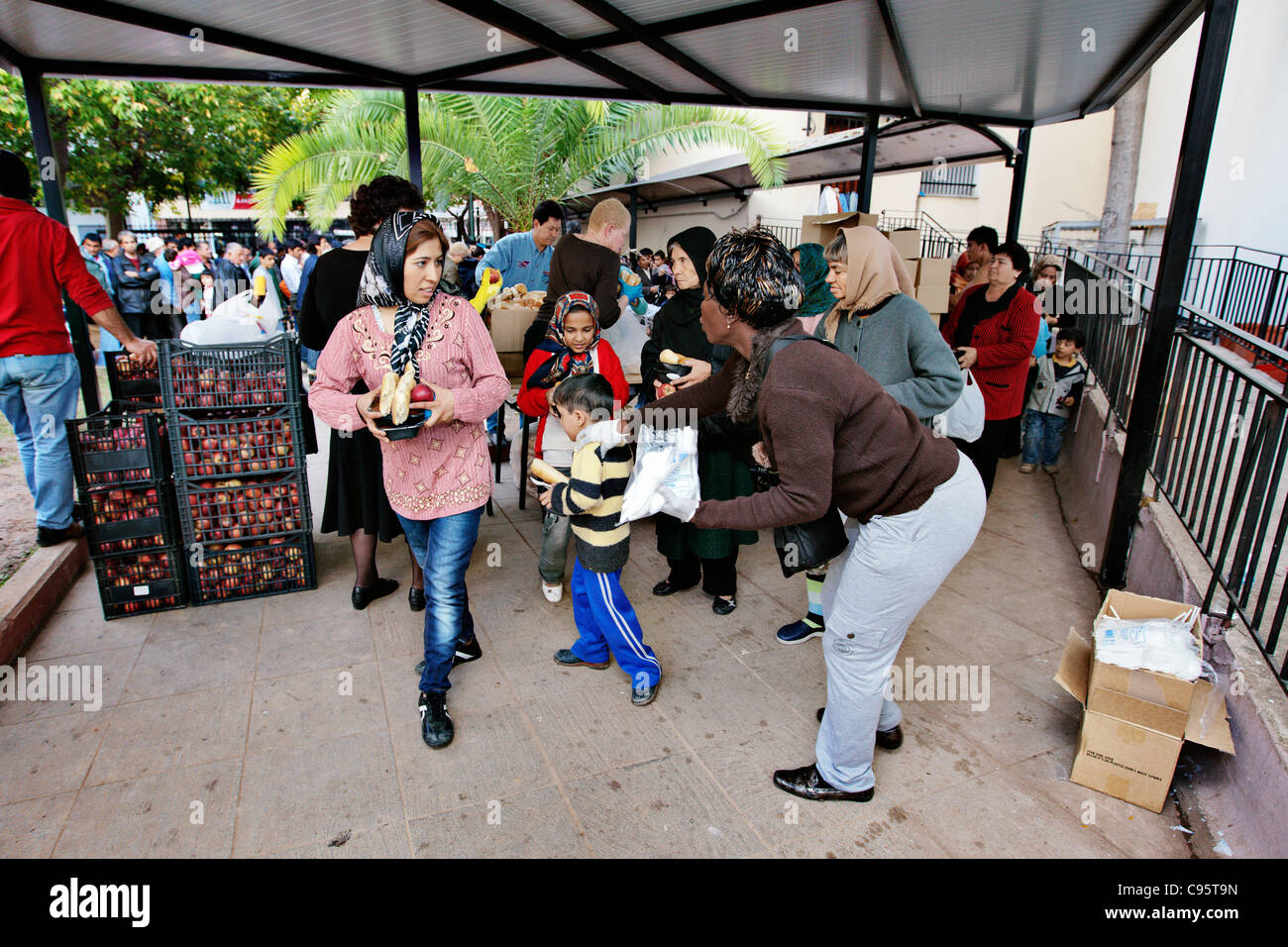 Afghan refugees getting free food in Athens, Greece Stock Photo - Alamy